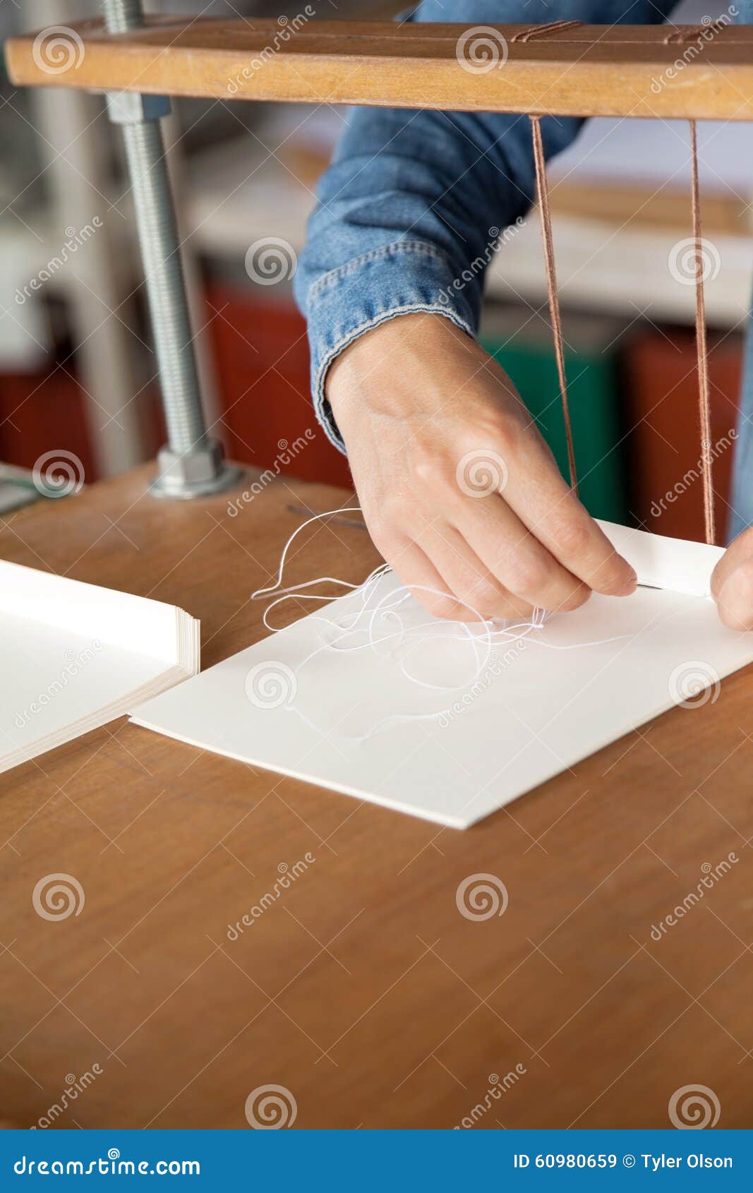 Worker S Hand Inserting Needle in Paper Stock Image - Image of ...