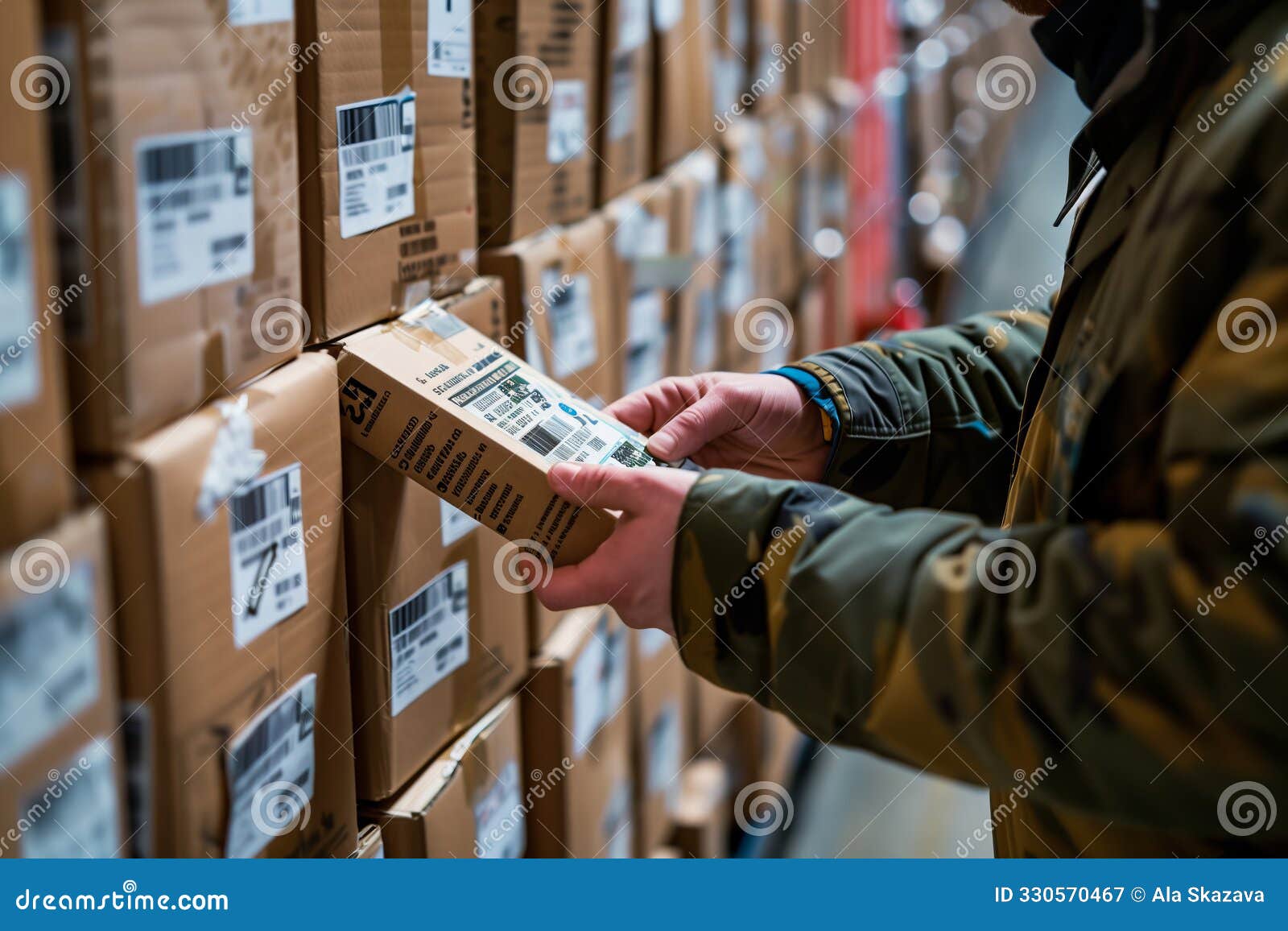 A Worker Scans Barcodes on Cardboard Boxes in a Warehouse Stock Image ...