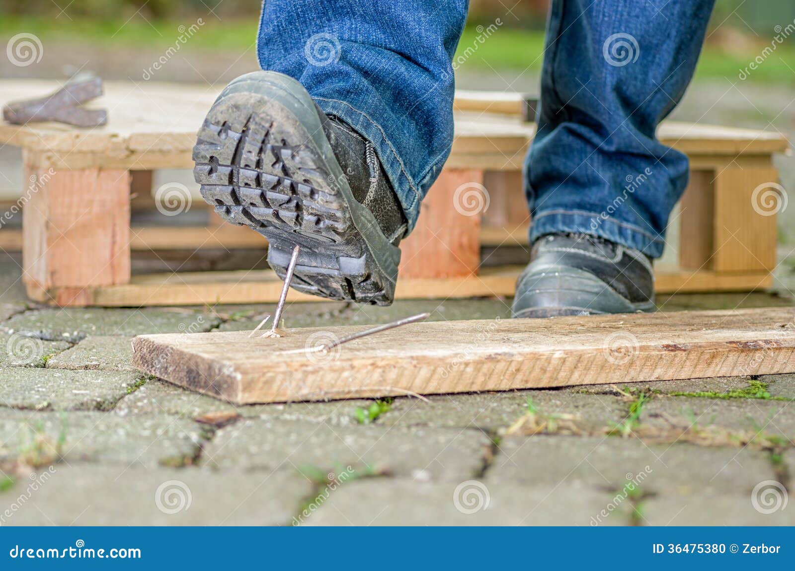 A Worker with Safety Shoes Steps on a Nail Stock Photo - Image of ...