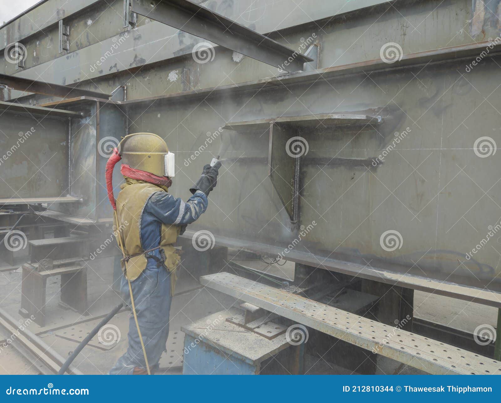 Worker is Sandblasting a Welding Surface and Steel Structure with ...
