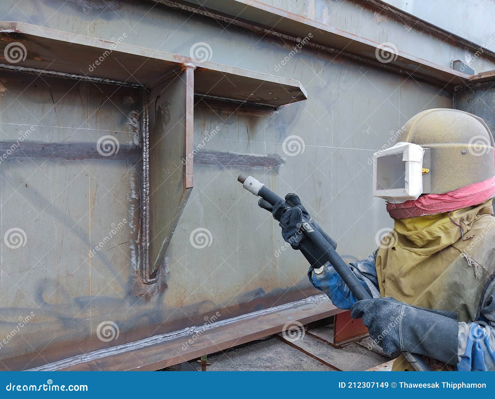 Worker is Sandblasting a Welding Surface and Steel Structure with ...