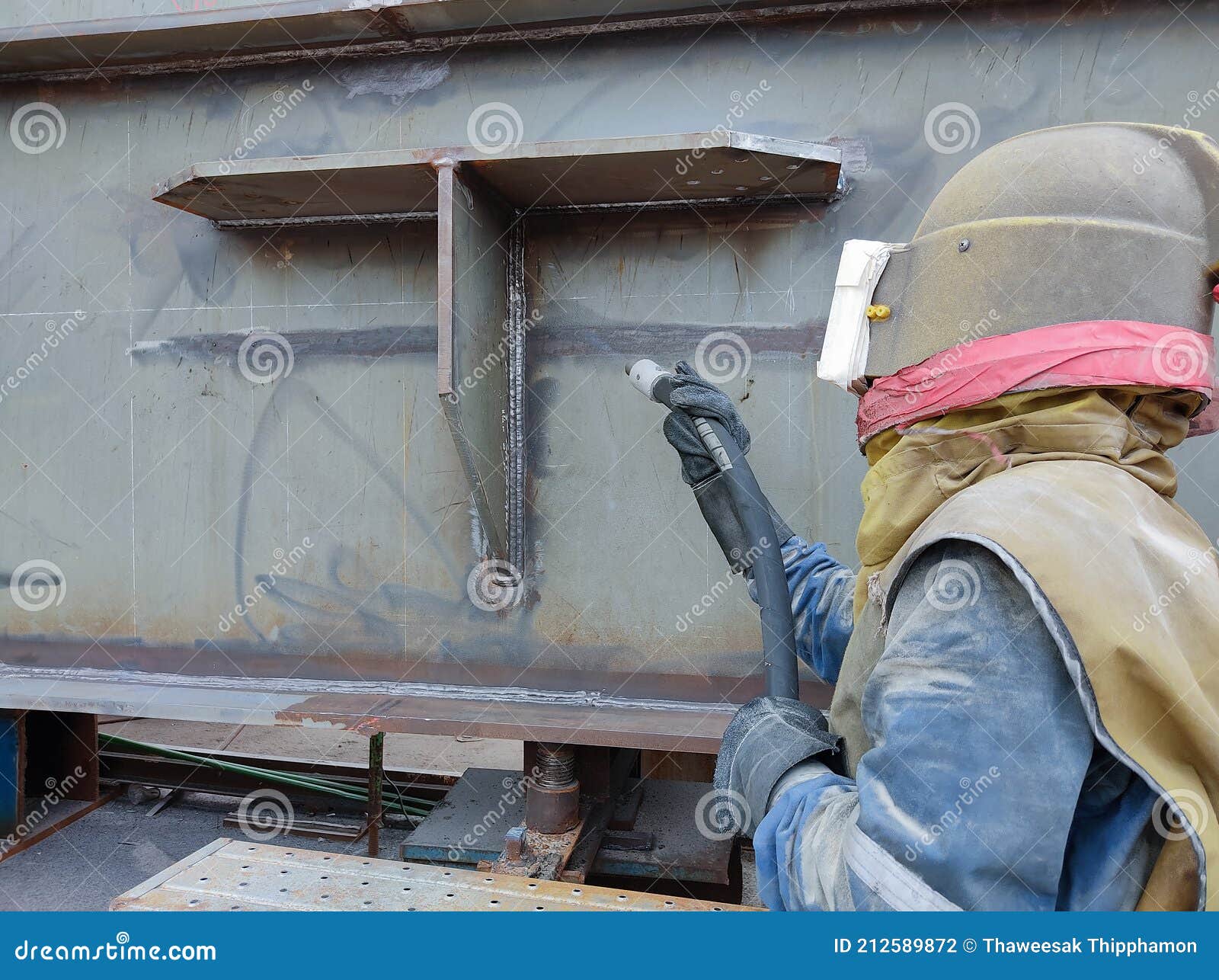 Worker is Sandblasting a Welding Surface and Steel Structure with ...