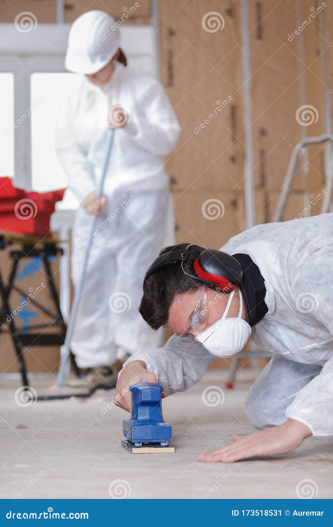 Worker Sanding Floor at Construction Site Stock Image - Image of person ...