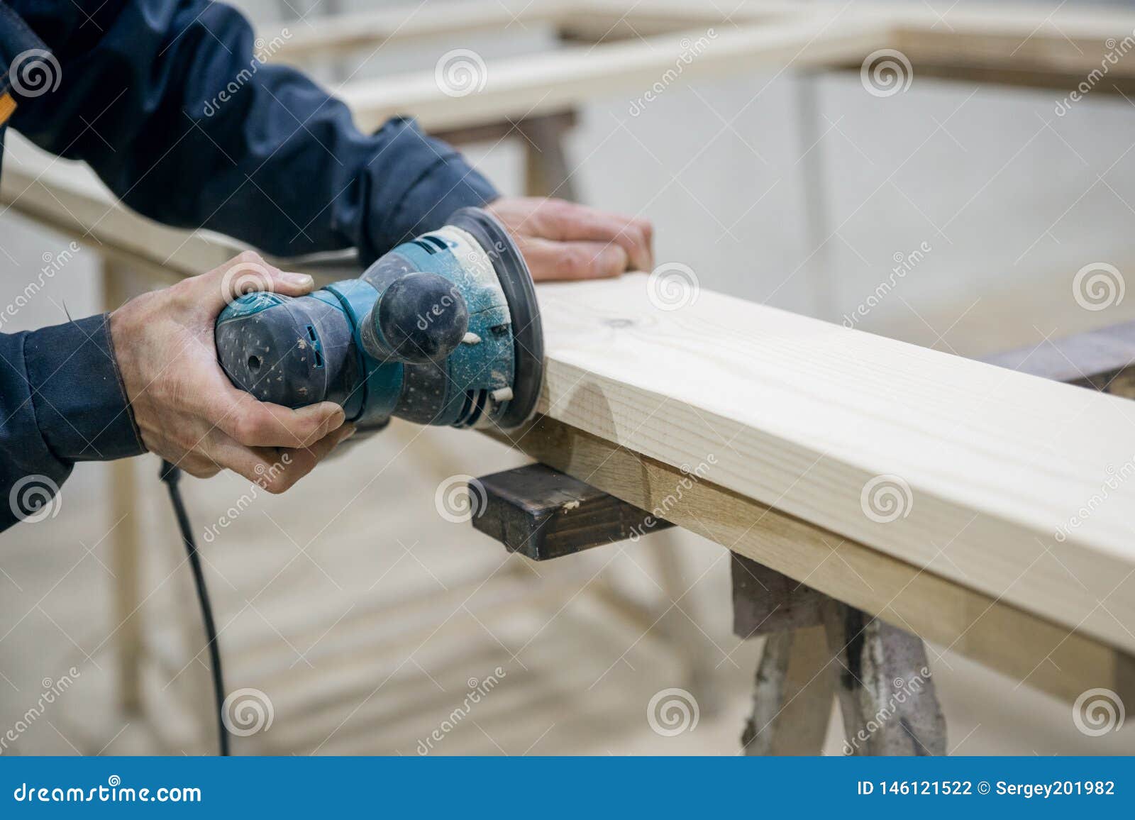 Worker Sanding the Wooden Surface. in the Hand of the Power Tool Stock ...