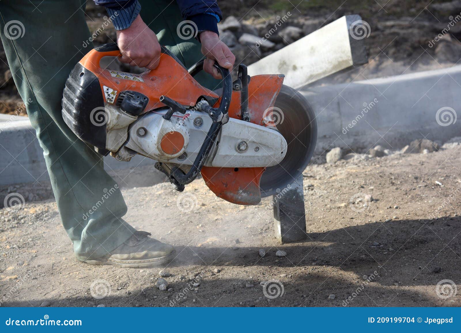 A Worker Saws Concrete with a Circular Saw. Stock Photo - Image of ... A Worker Saws Concrete with a Circular Saw. Stock Photo - Image of ...