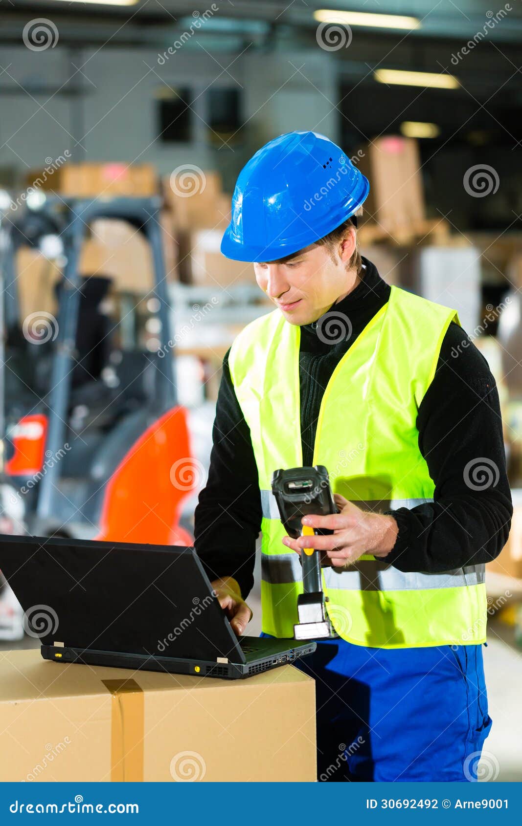 Worker with Scanner and Laptop at Forwarding Stock Photo - Image of ...