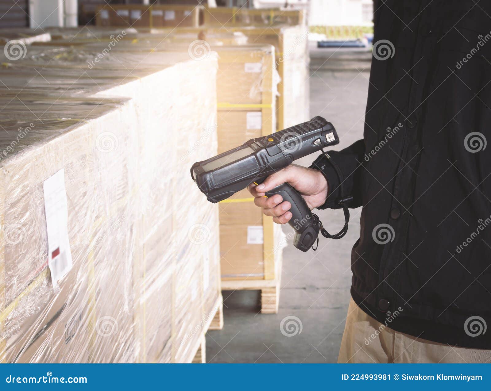 Worker Scanning Bar Code Scanner with Package Boxes. Computer WorkTools ...