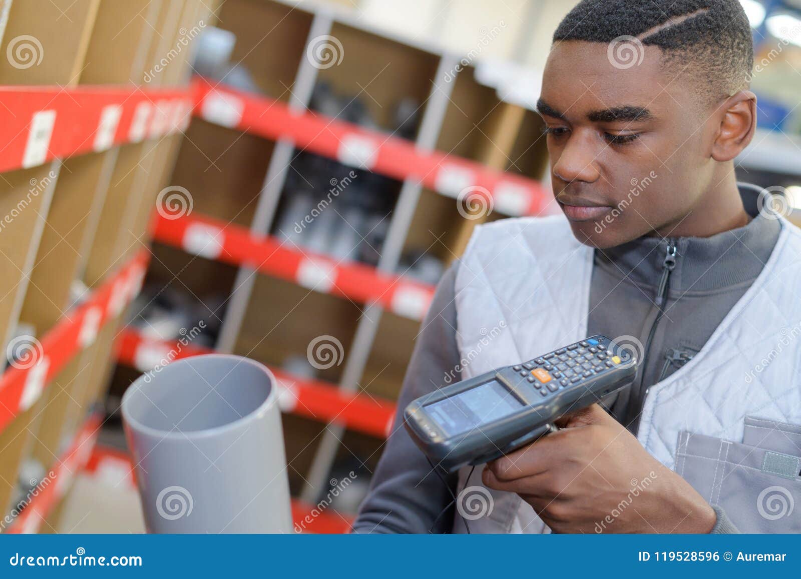 Worker scanning a barcode stock photo. Image of handheld - 119528596