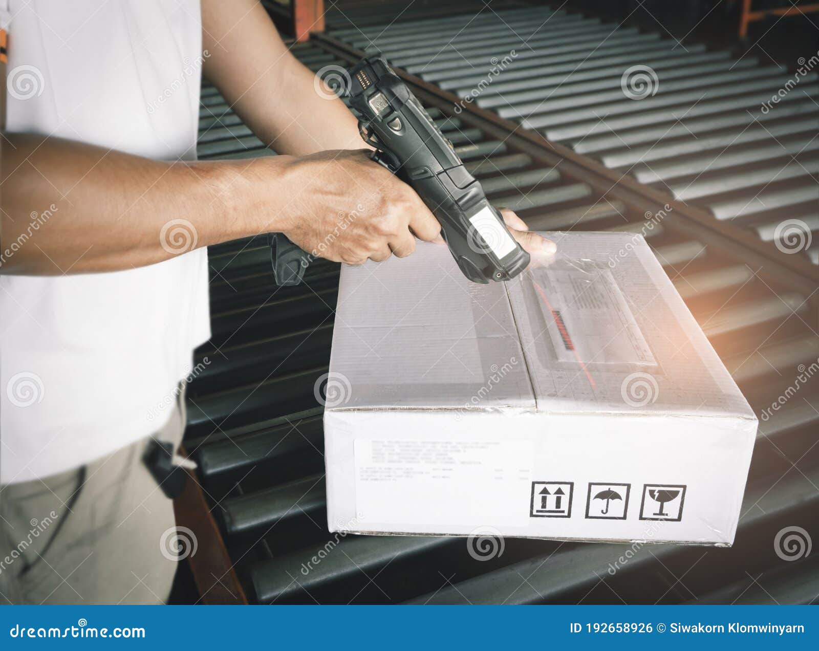 Worker Scanning Barcode Scanner with Red Laser on Parcel Box. Shipment ...
