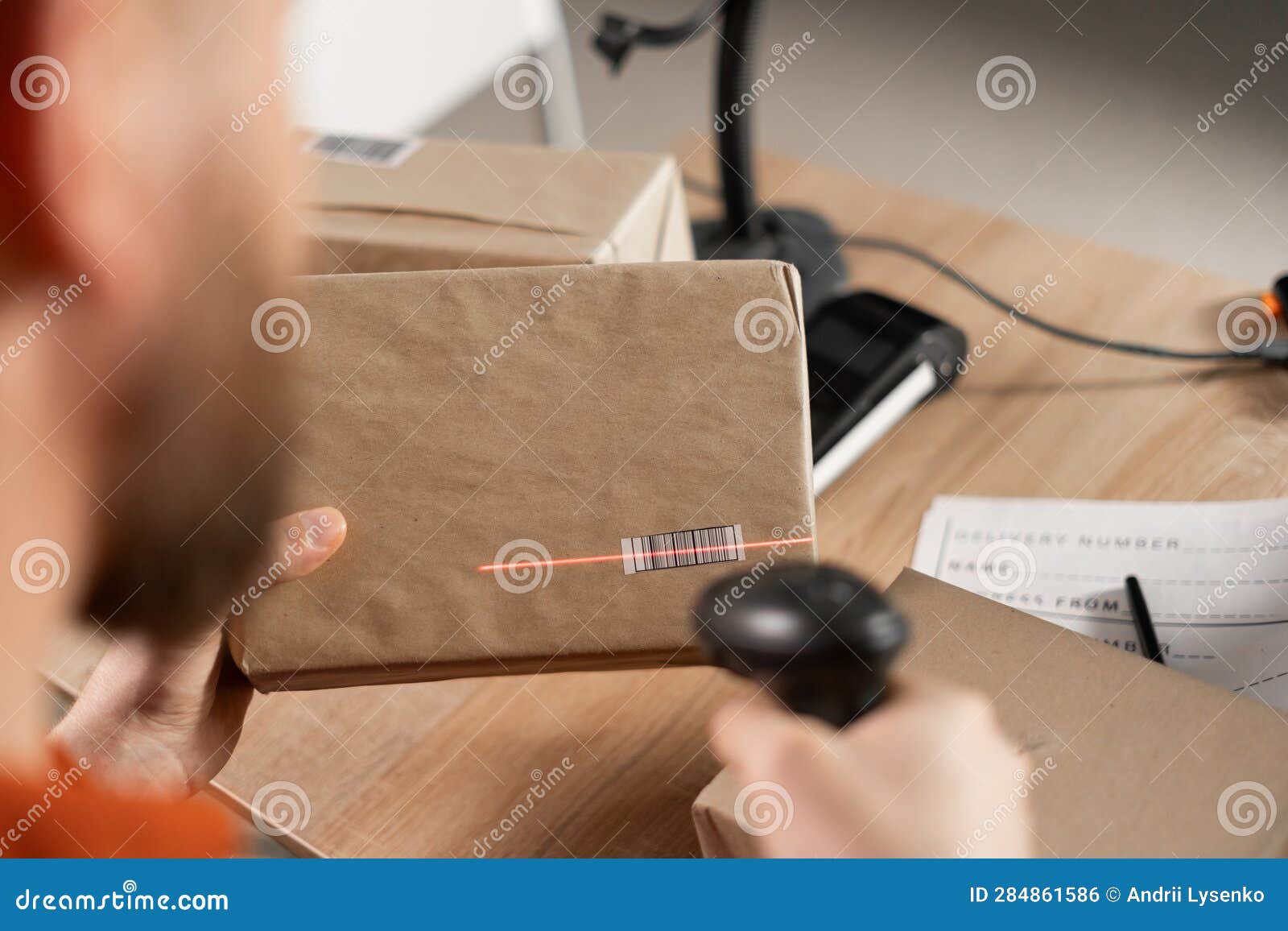 Worker Scanning Package in Warehouse with Barcode Scanner Check Goods ...