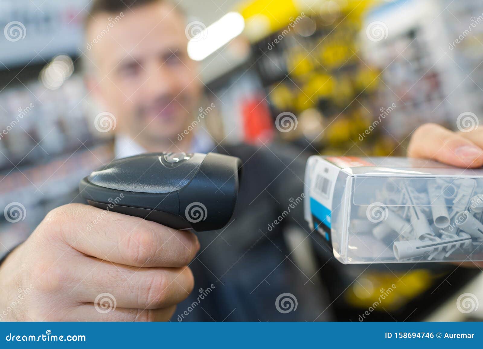 Worker Scanning Products in Hardware Store Stock Photo - Image of ...