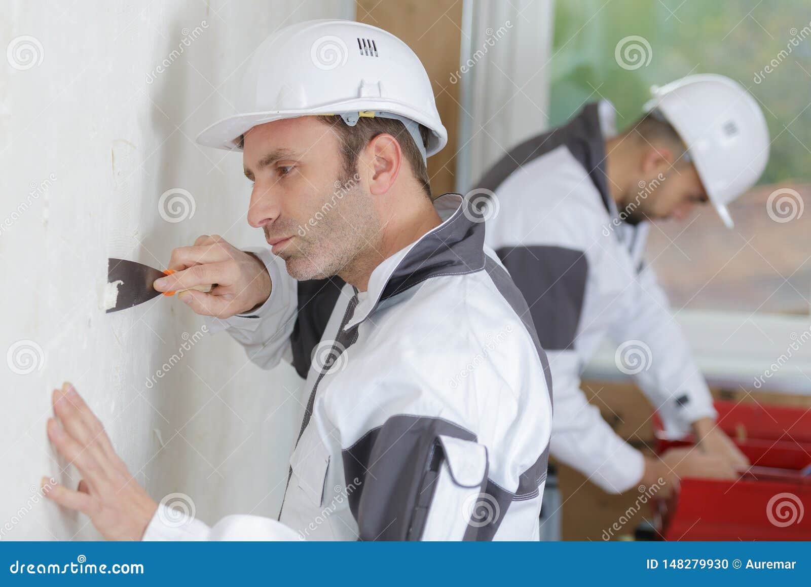 Worker scraping the wall stock photo. Image of preparation - 148279930