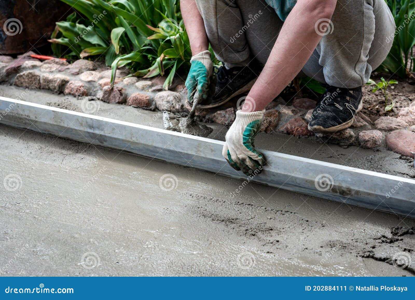 Worker Screeding Outdoor Cement Floor with Screed Stock Image - Image ...