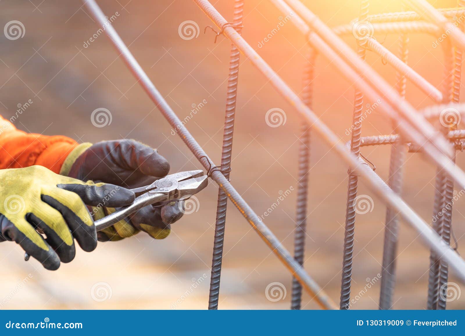 Worker Securing Steel Rebar Framing With Wire Plier Cutter Tool Stock ...