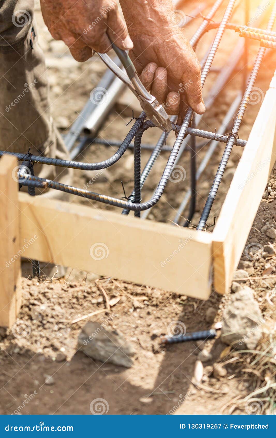 Worker Securing Steel Rebar Framing With Wire Plier Cutter Tool Royalty ...