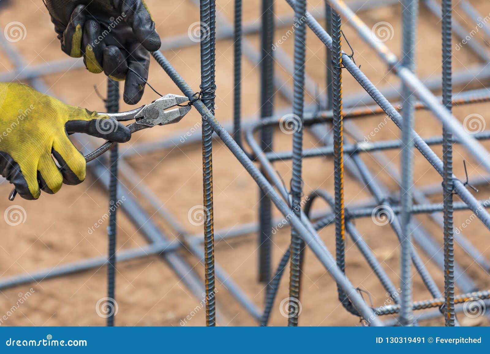 Hands of Worker Securing Steel Rebar Framing with Wire Plier Cutter ...