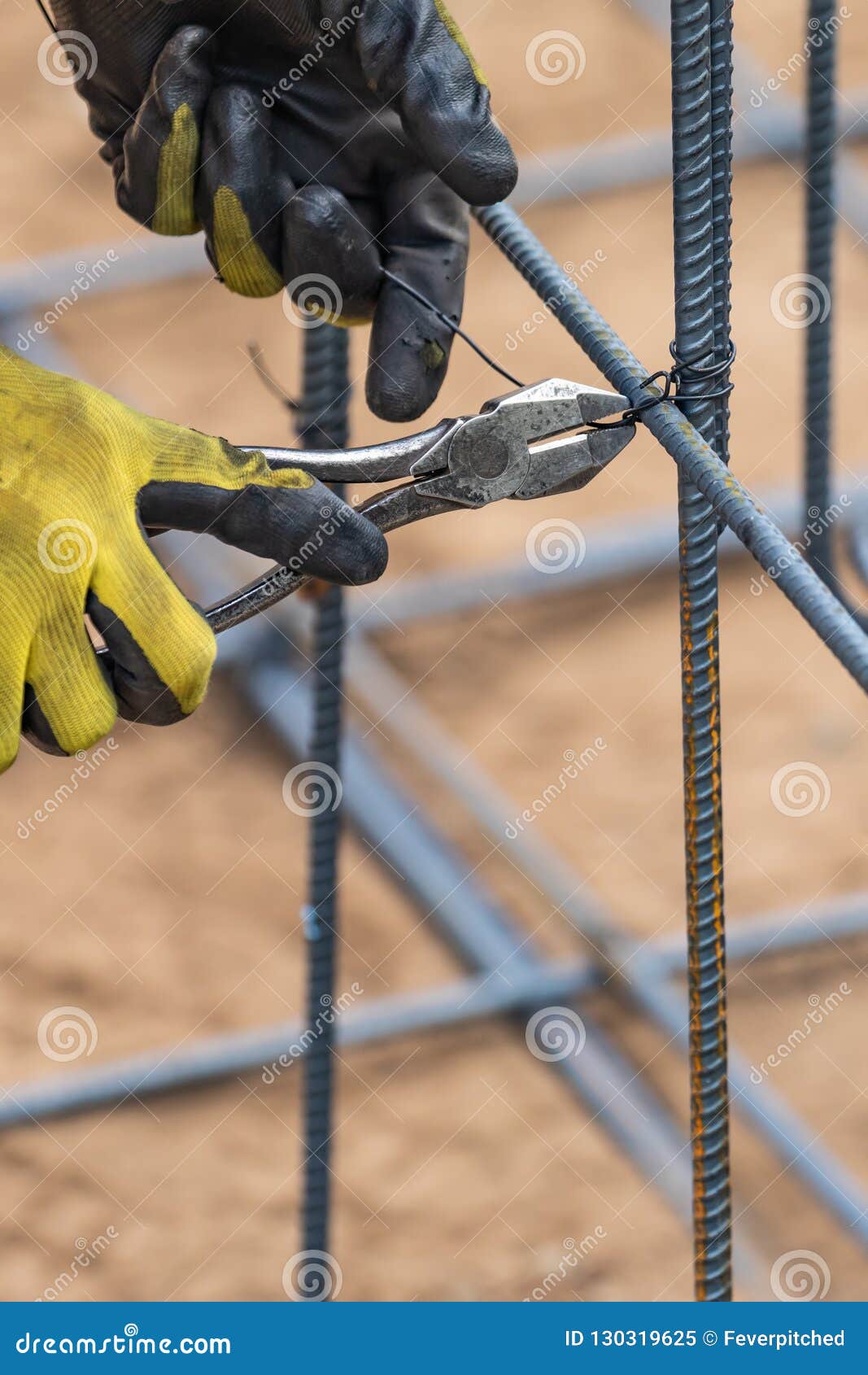 Hands of a Worker Securing Steel Rebar Framing with Wire Plier Cutter ...