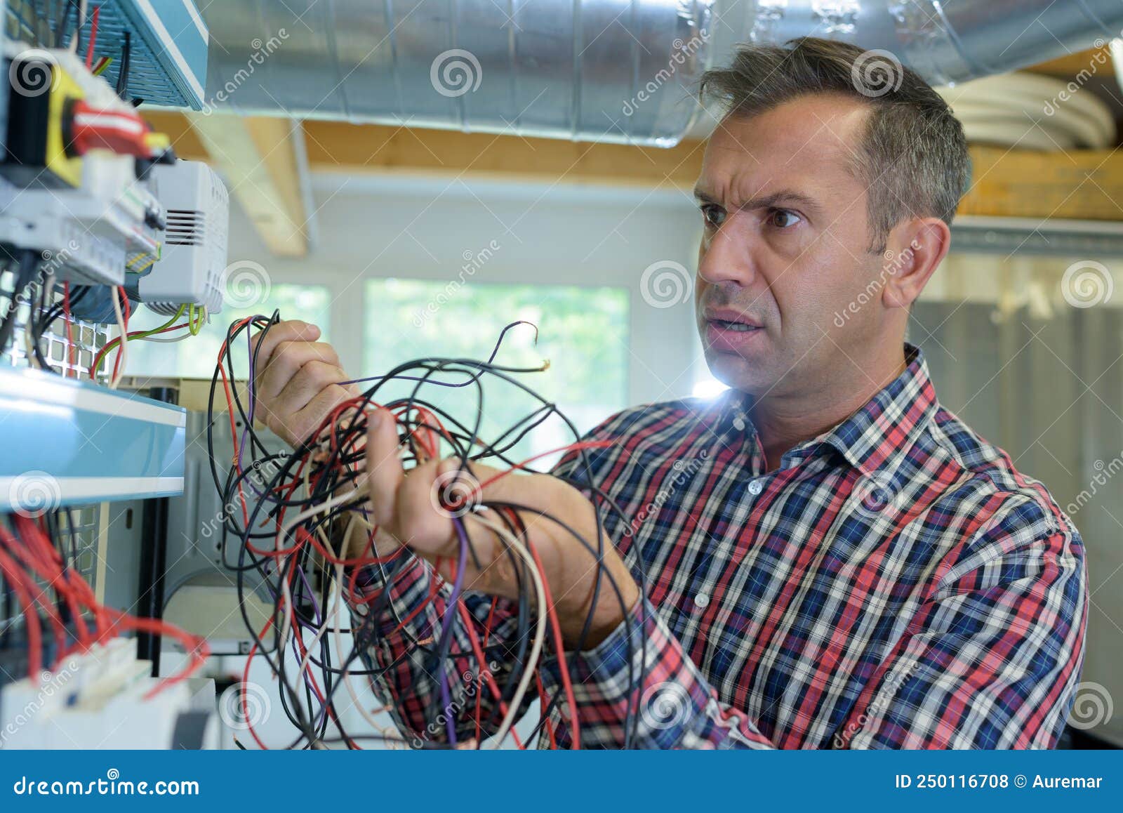 Worker Shocked To Find Electrical Mess Stock Photo - Image of line ...