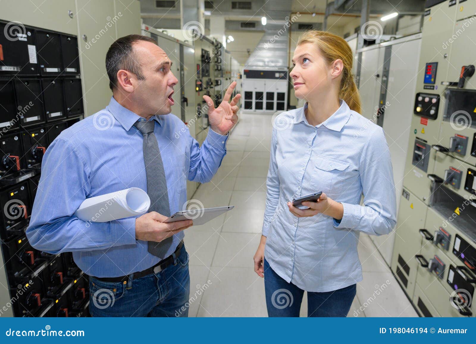 Worker Shouting at Female Colleague in Server Room Stock Photo - Image ...