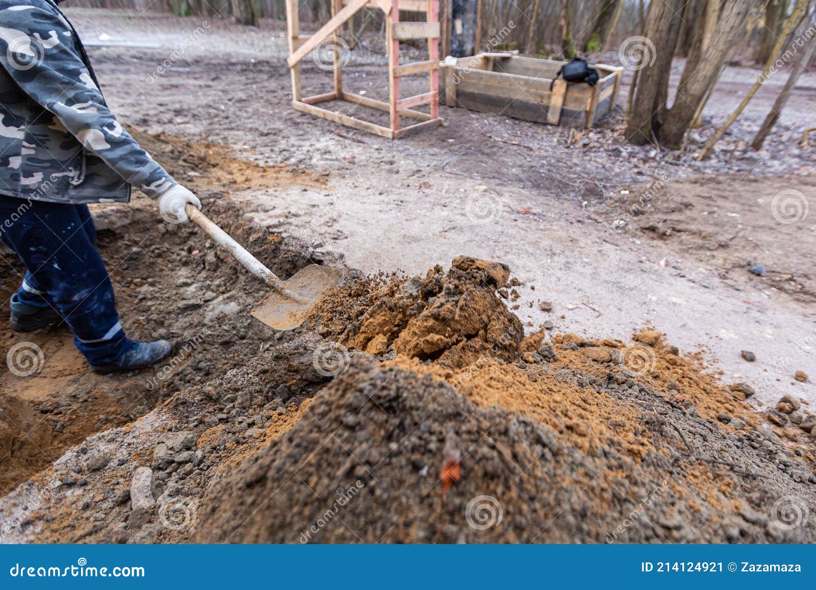 Worker with Shovel is Digging a Pit on Construction Site. Concept of ...
