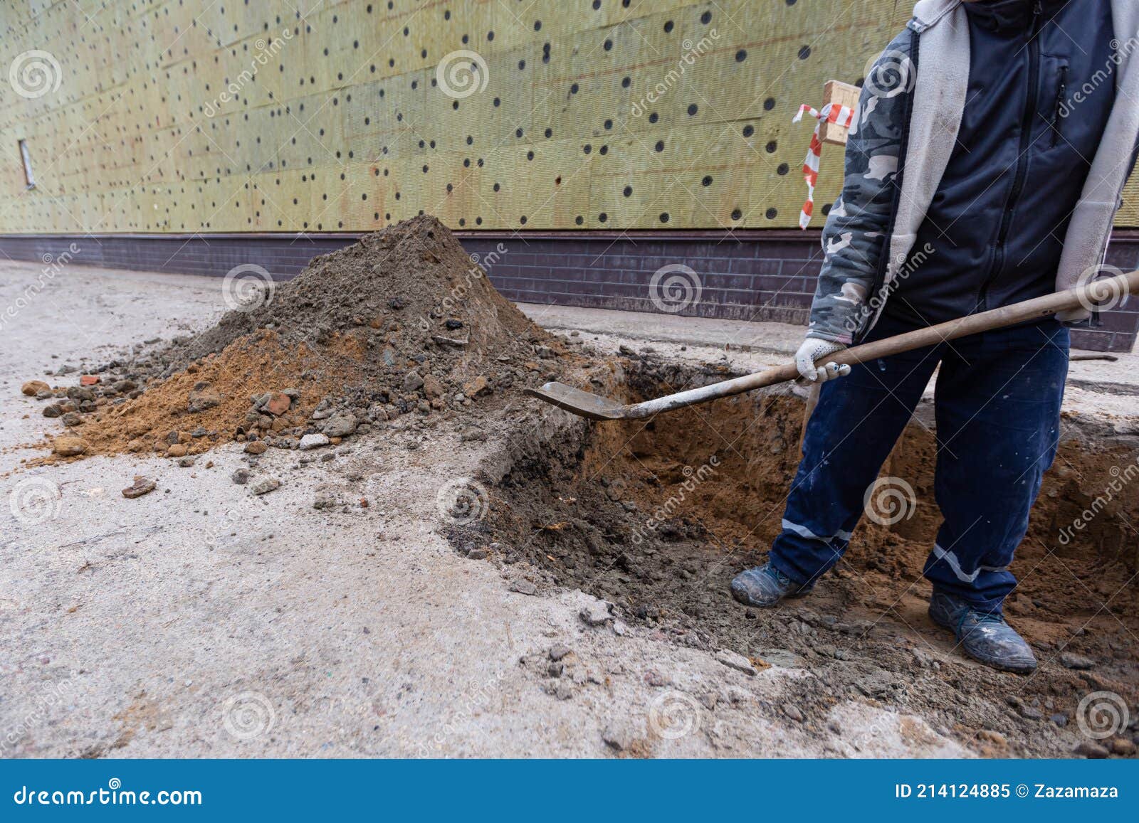 Worker with Shovel is Digging a Pit on Construction Site. Concept of ...