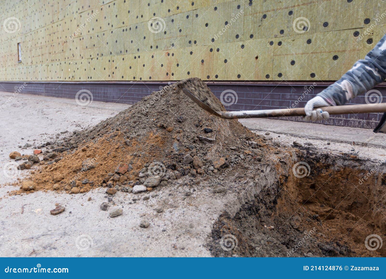 Worker with Shovel is Digging a Pit on Construction Site. Concept of ...