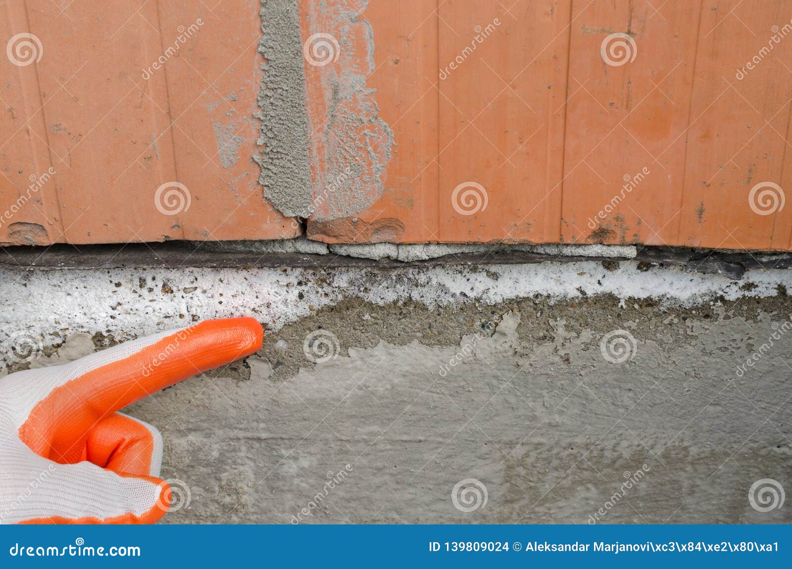 Worker Shows Saltpeter on Foundation, Capillary Moisture Stock Photo ...