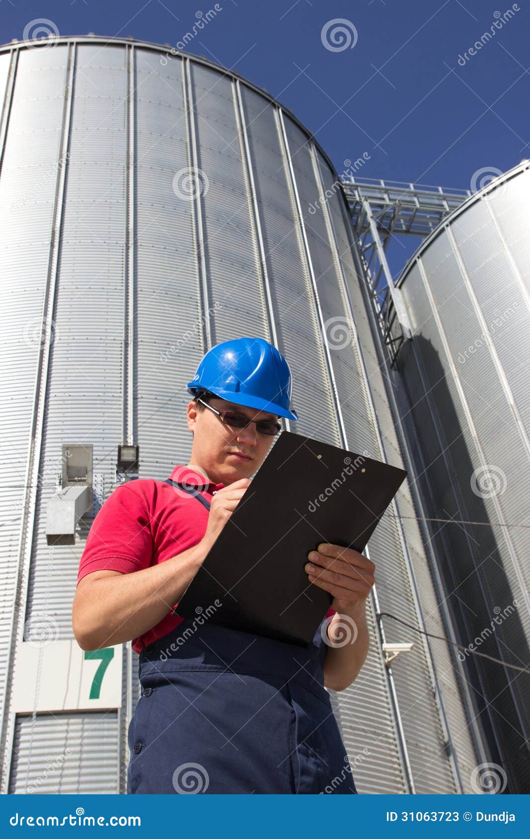 Worker in silo company stock image. Image of working - 31063723