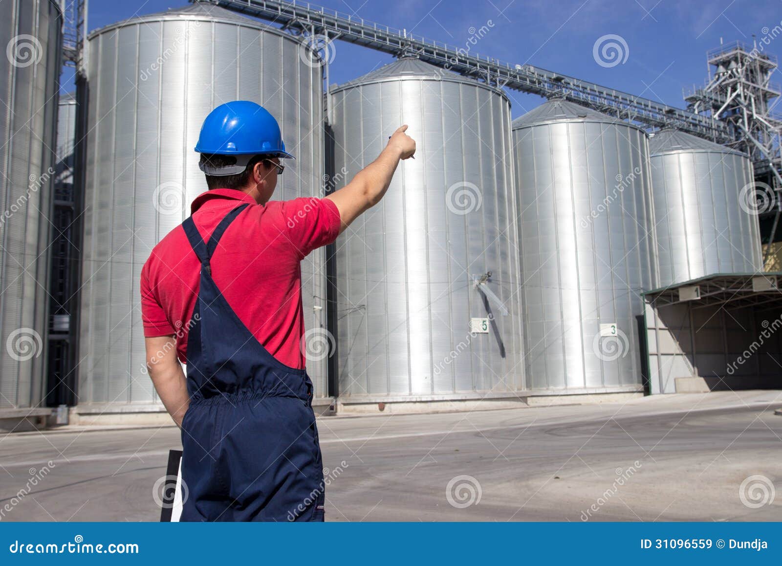 Worker in silo company stock image. Image of overalls - 31096559