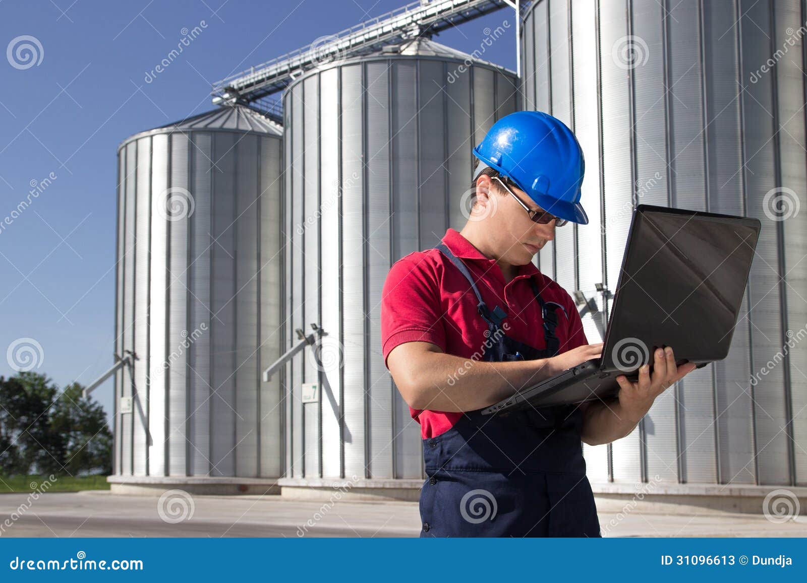 Worker in silo company stock image. Image of laptop, industrial - 31096613