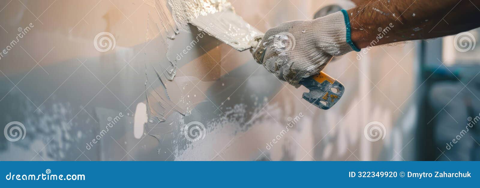 A Worker Smoothing Out Joint Compound on Drywall, Capturing the Dusty ...