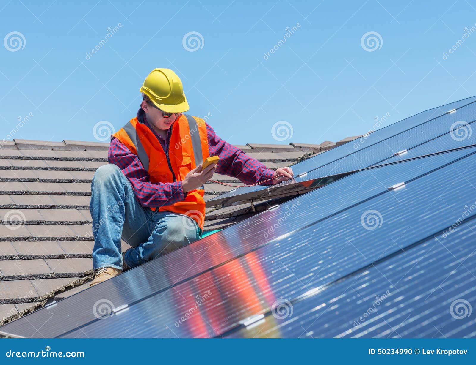 Worker and solar panels stock photo. Image of house, construction ...