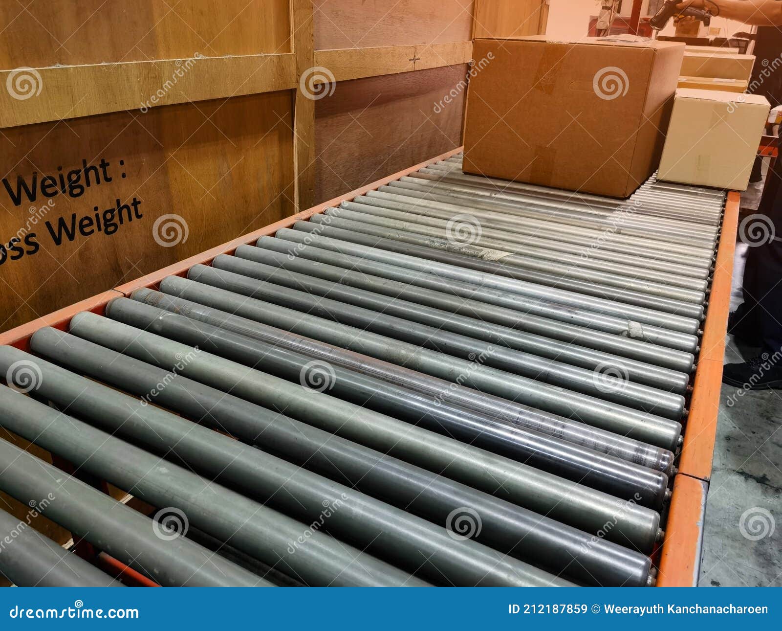 Worker Sorting Shipment Cartons Box on Conveyor Belt in Interior ...