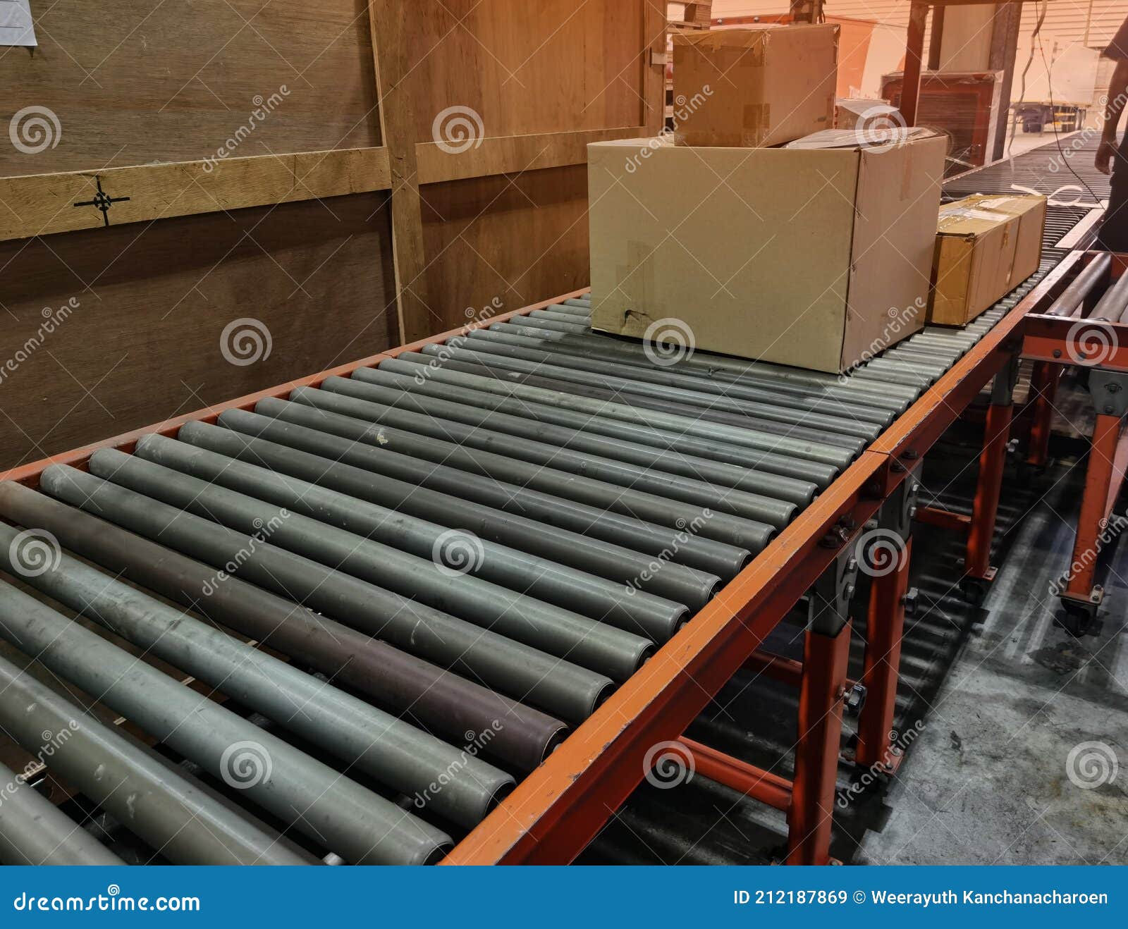 Worker Sorting Shipment Cartons Box on Conveyor Belt in Interior ...