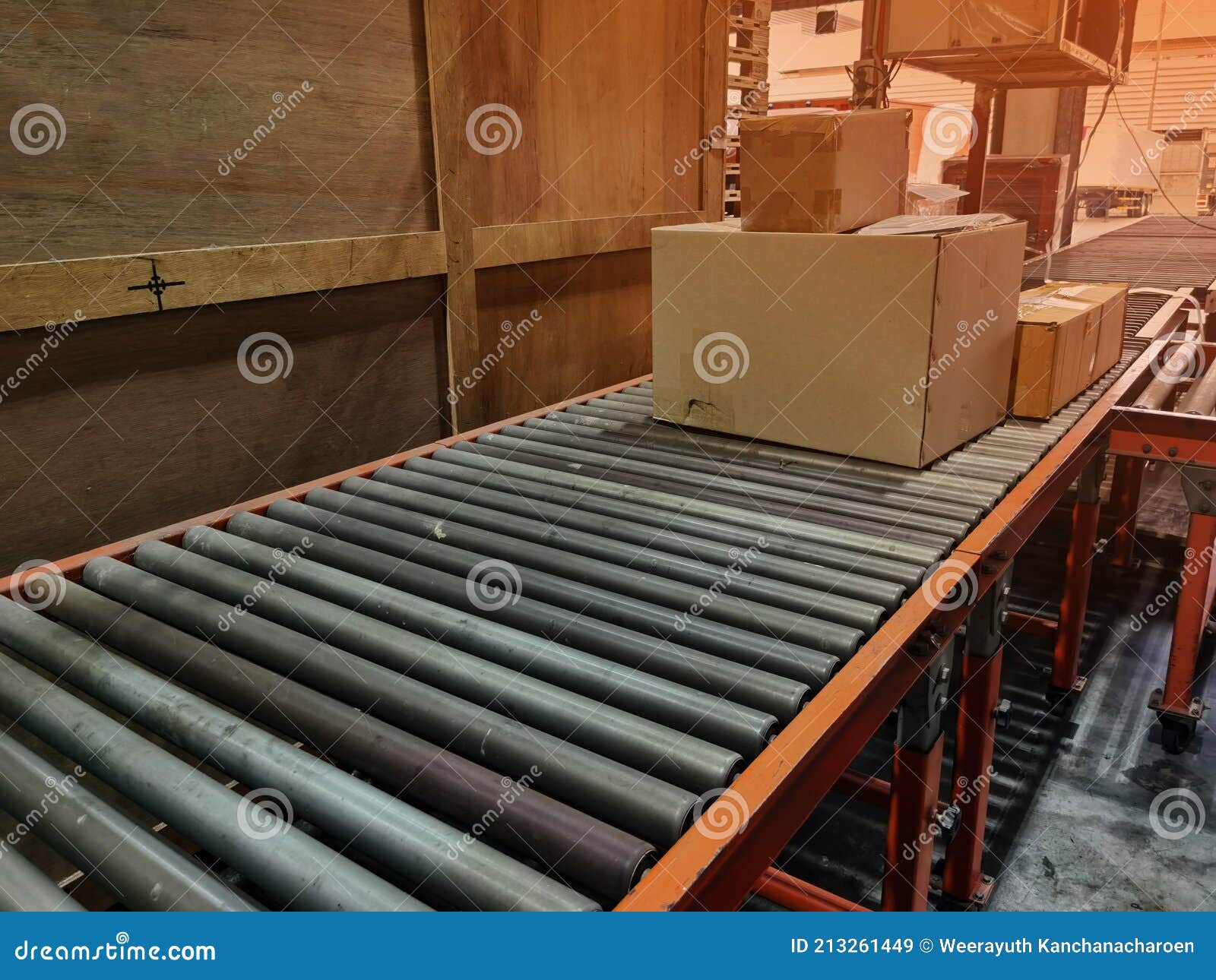 Worker Sorting Shipment Cartons Box on Conveyor Belt in Interior ...