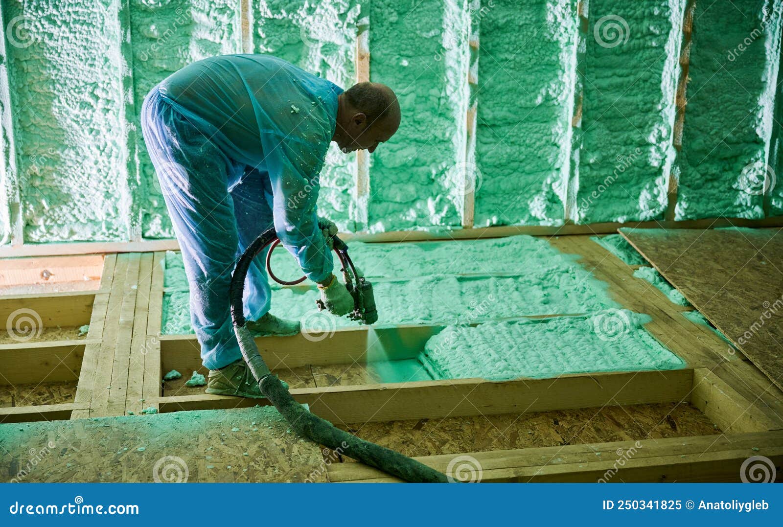 Worker Spraying Polyurethane Foam for Insulating Wooden Frame House ...