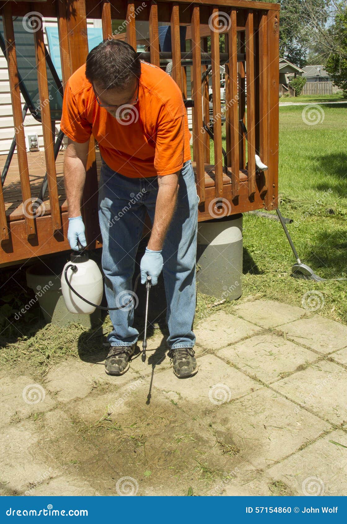 Worker Spraying Weed Killer on a Old Patio Stock Photo - Image of ...