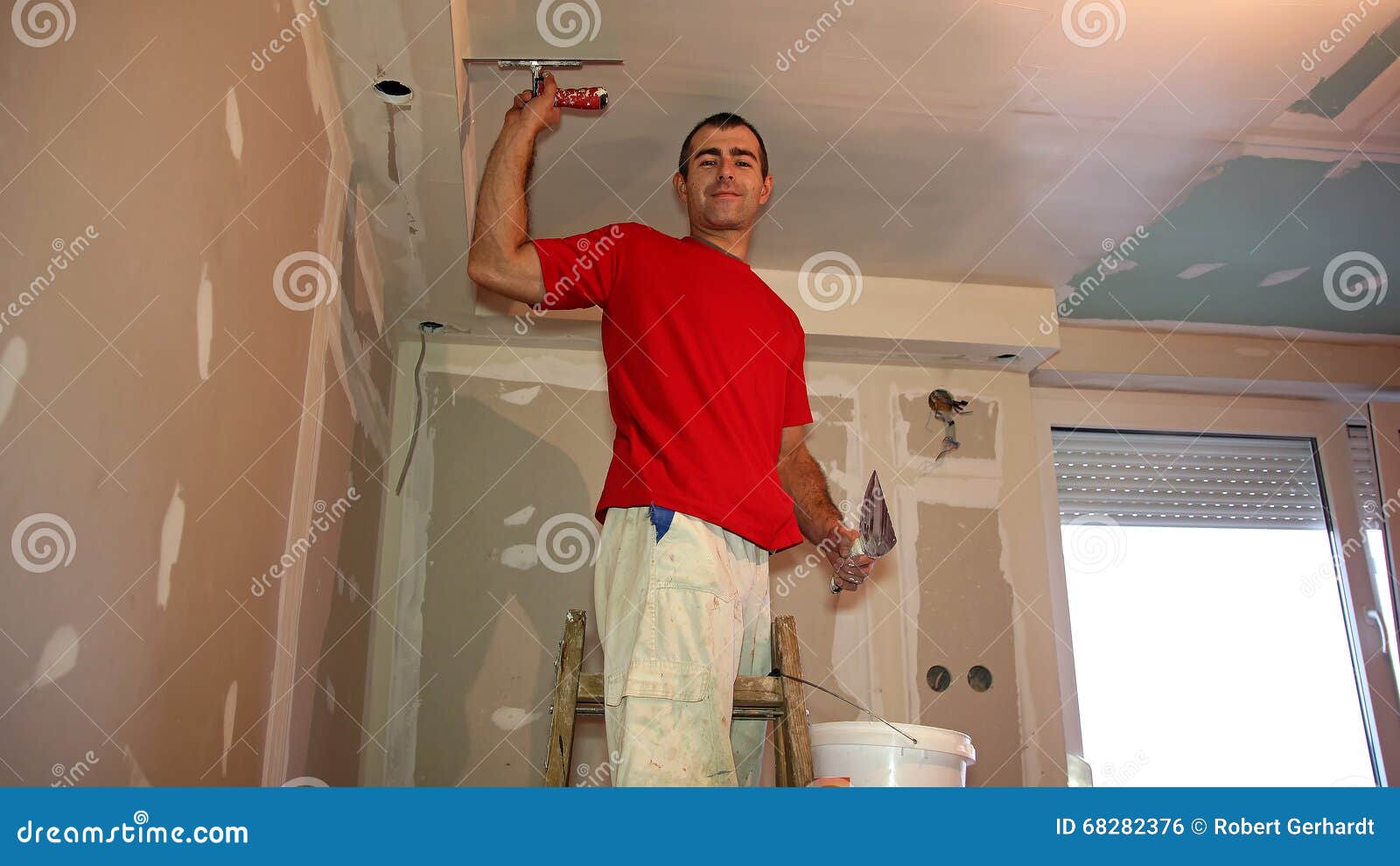 Worker Spreading Plaster with Trowel To Gypsum Board Stock Photo ...