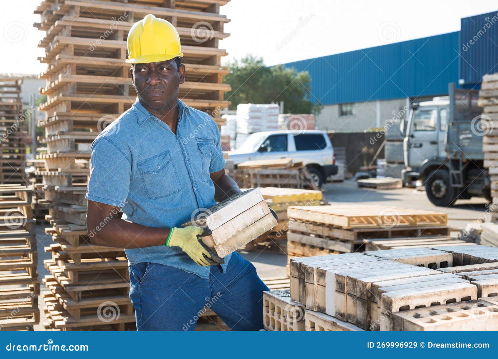 Worker Stacking Bricks in Warehouse of Building Materials Clpseup Stock ...