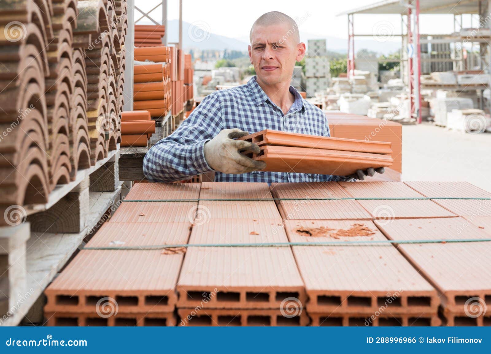 Worker Stacking Bricks in Warehouse of Materials Stock Photo - Image of ...