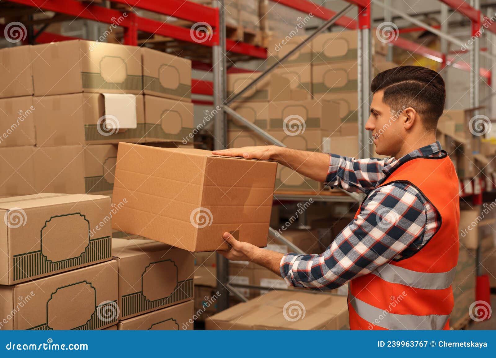 Worker Stacking Cardboard Boxes in Warehouse. Wholesaling Stock Image ...