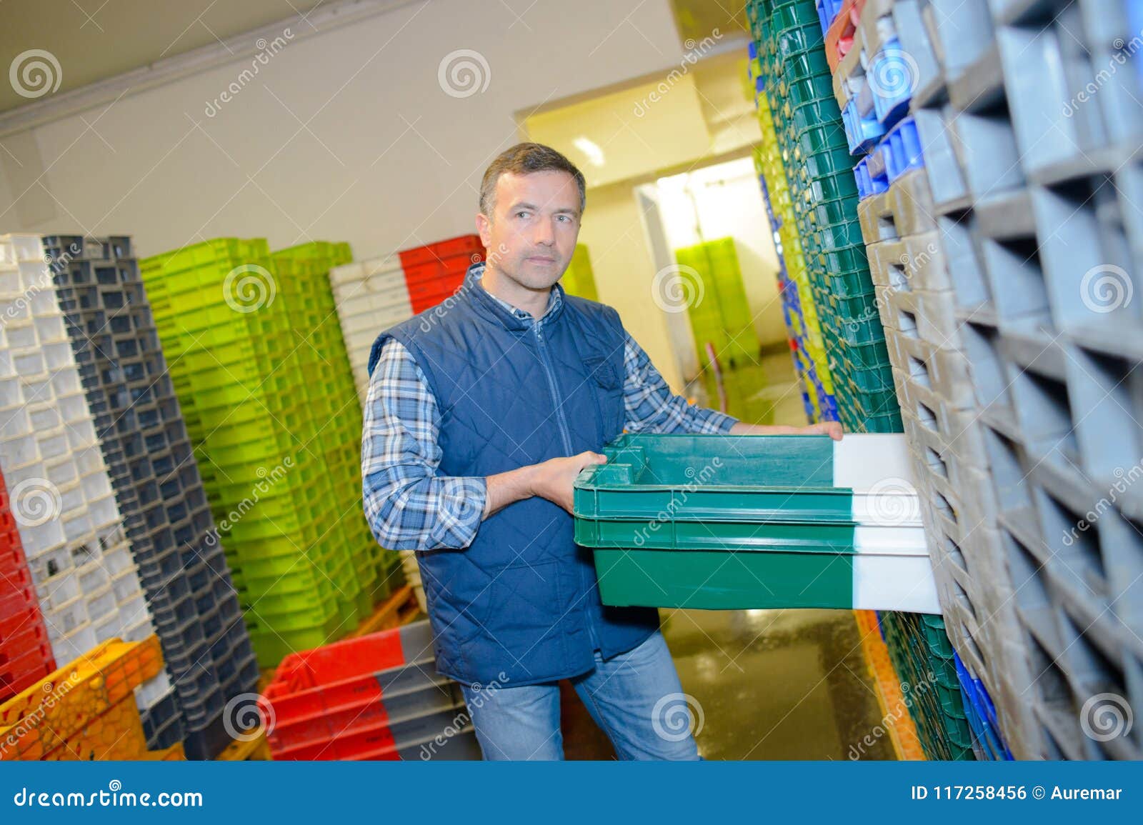 Worker Stacking Empty Crates Stock Photo - Image of crate, industry ...