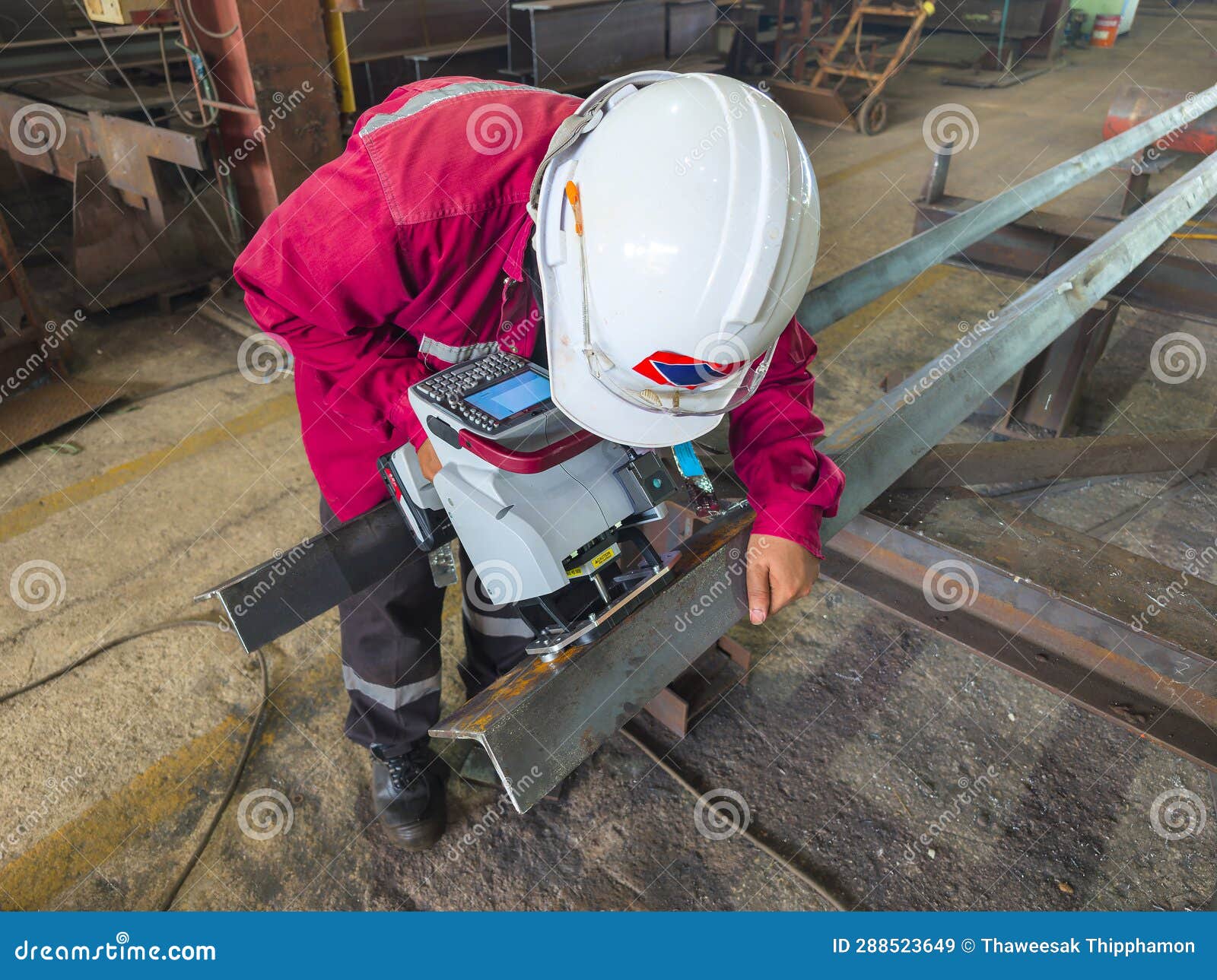 Worker is Stamping a Number on a Steel Structure Piece with a Mobile ...