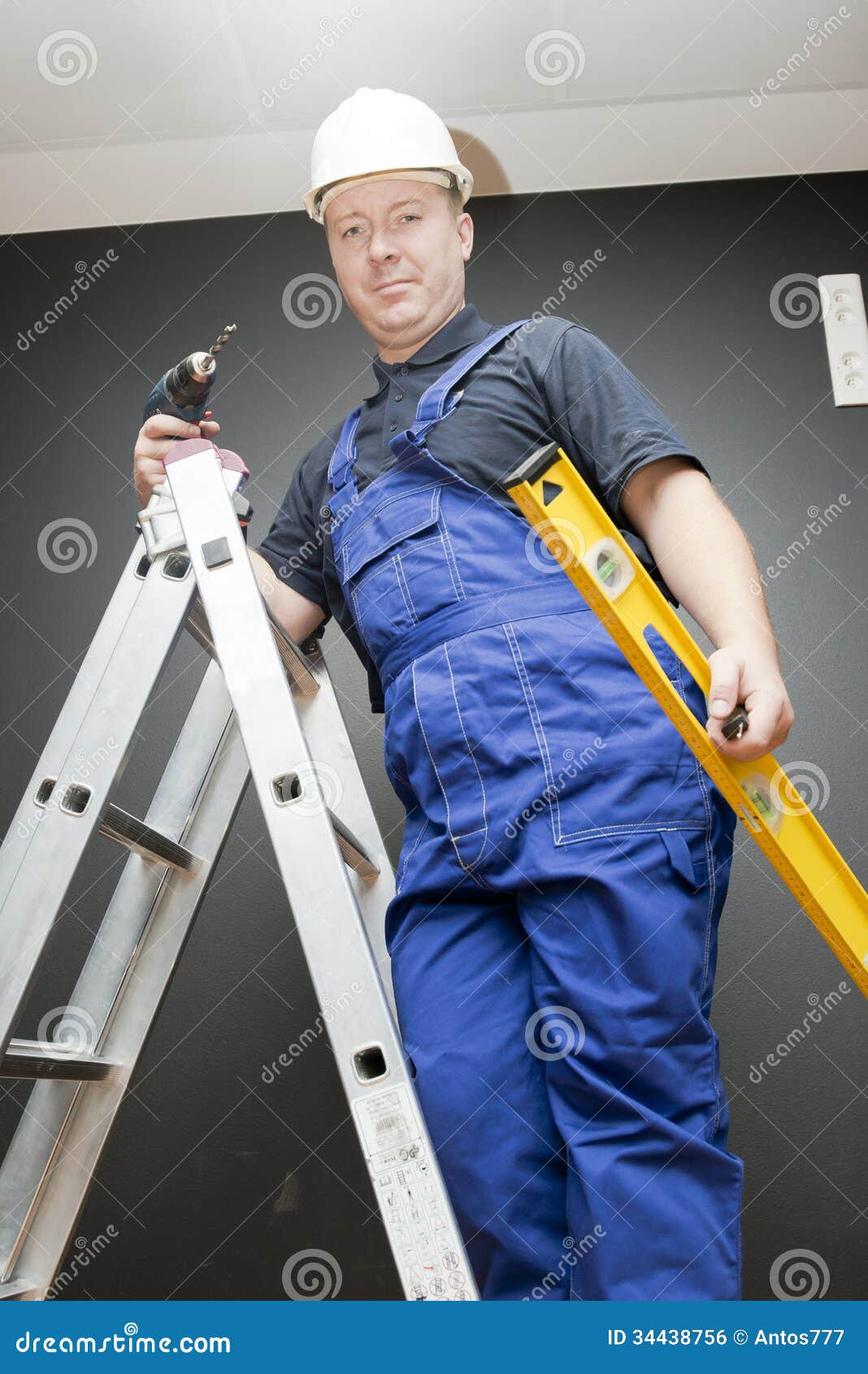 Worker Standing on a Ladder Stock Photo - Image of blue, indoors: 34438756
