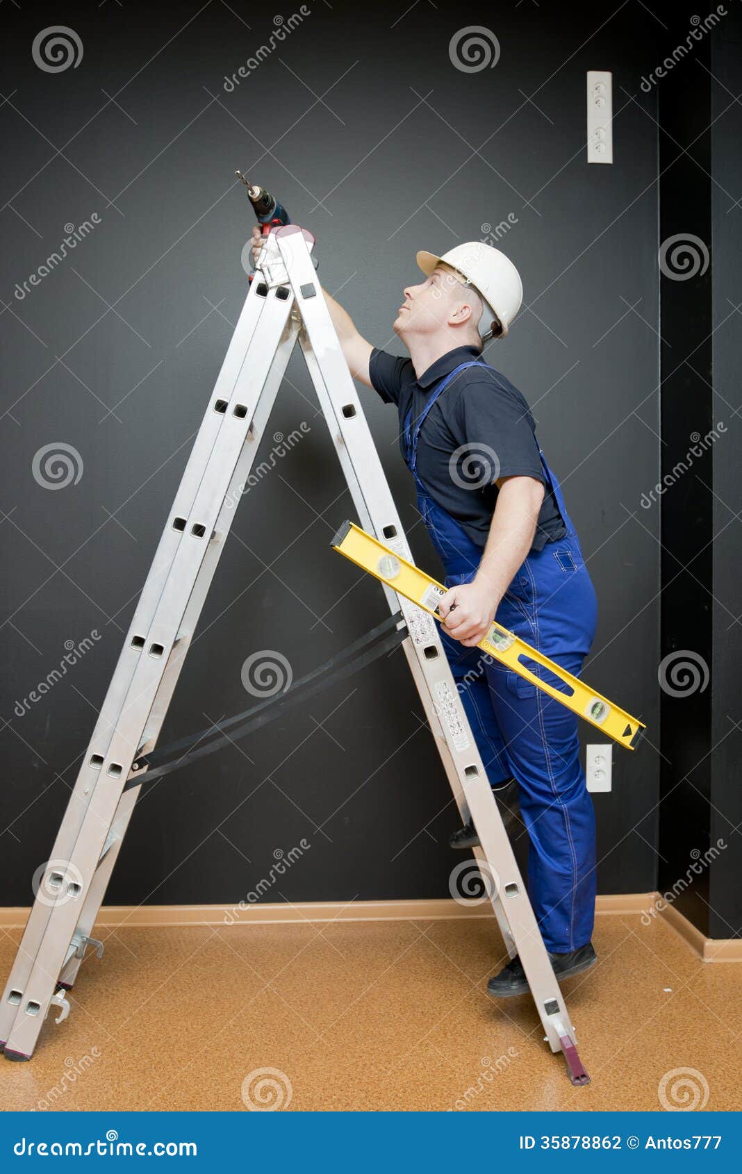 Worker Standing on a Ladder Stock Photo - Image of occupation ...