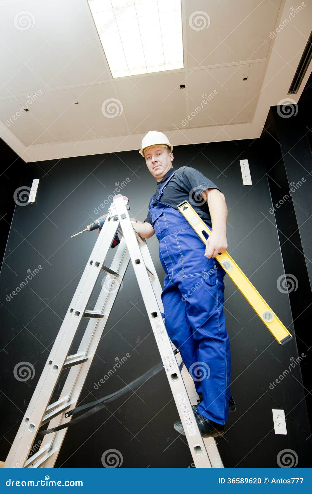 Worker Standing on a Ladder Stock Photo - Image of people, indoors ...