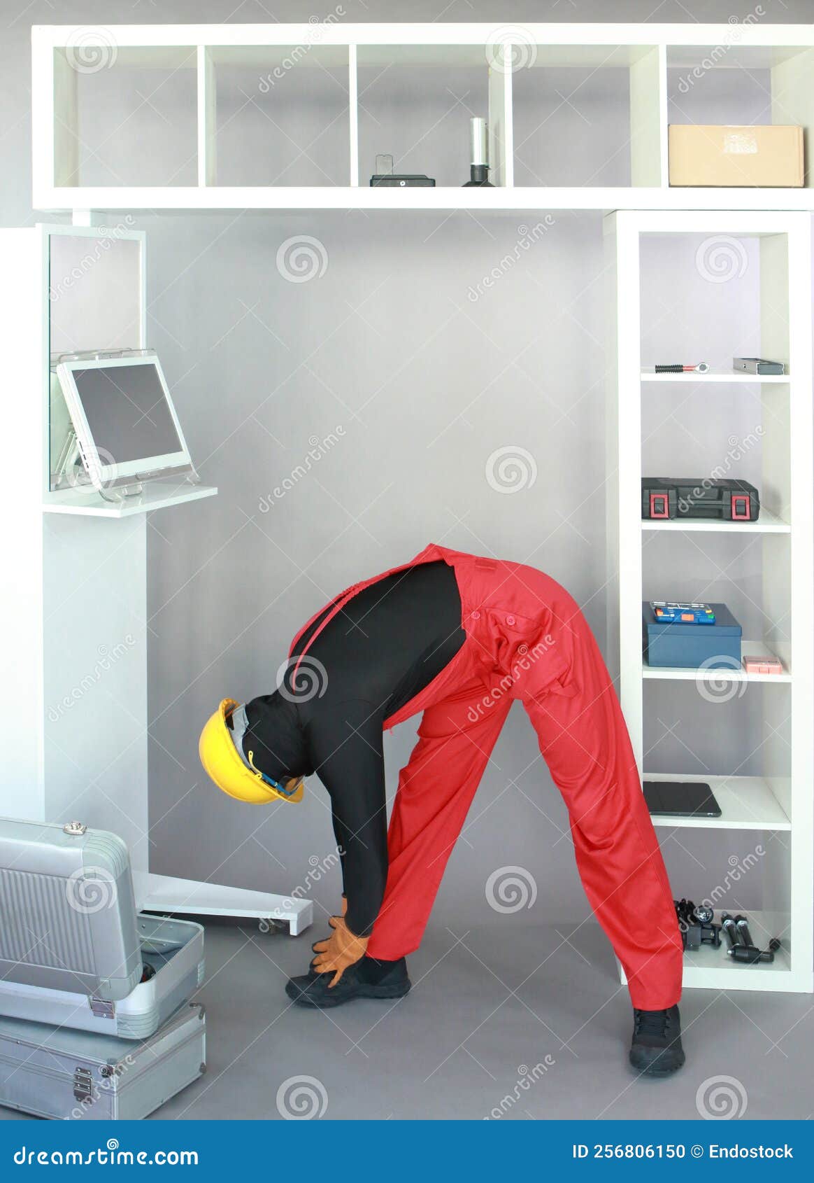 Worker Stretching Back in the Industrial Environment. Stock Photo ...