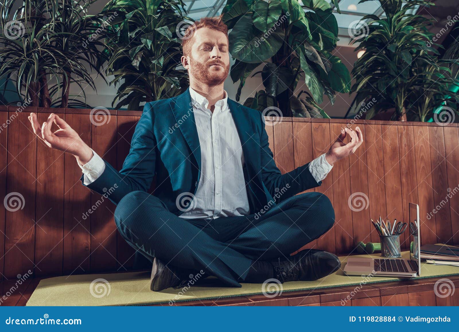 Worker Meditating on Bench in Office. Stock Photo - Image of happy ...