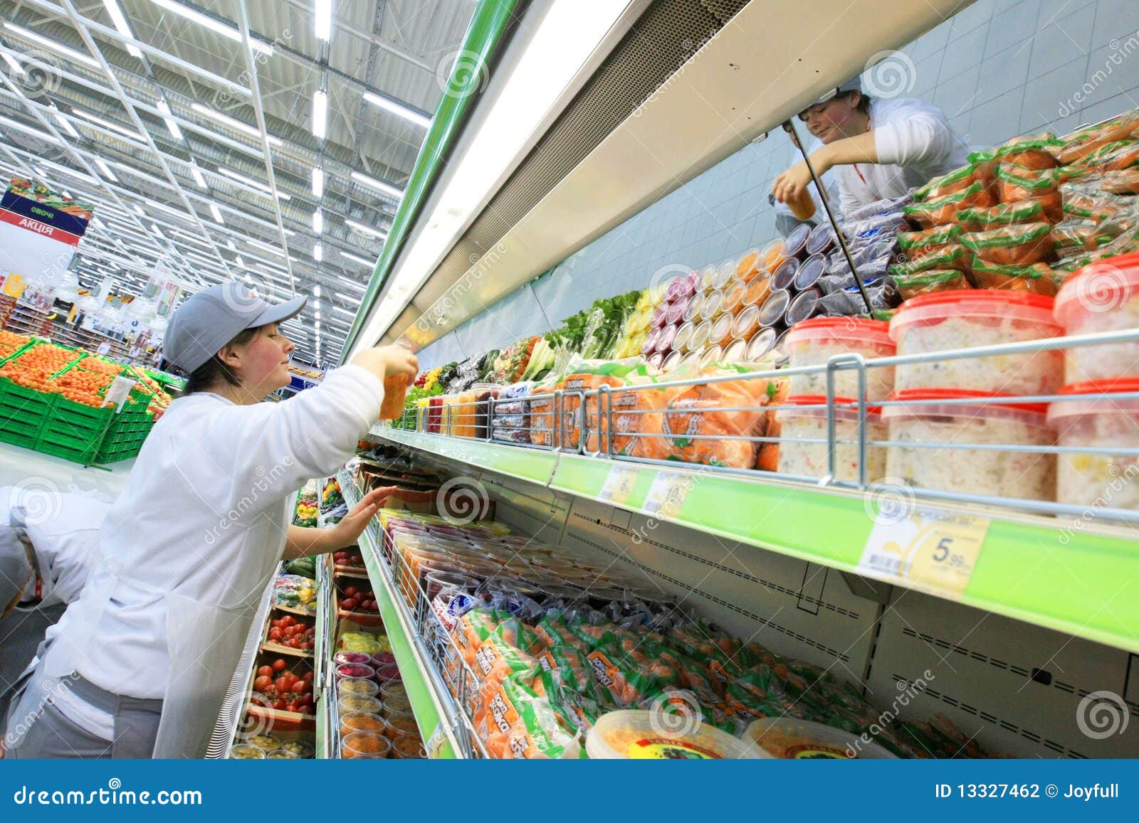 Worker in supermarket editorial photography. Image of market - 13327462