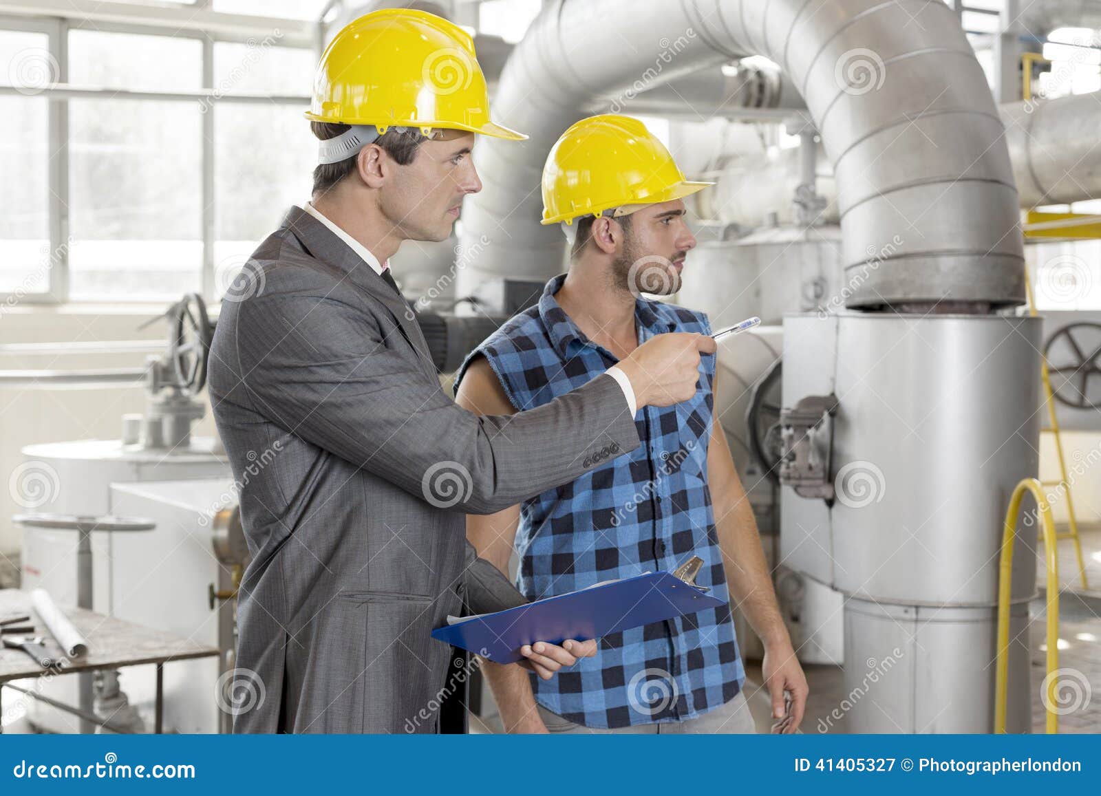 Worker with Supervisor Inspecting Industrial Area Stock Image - Image ...